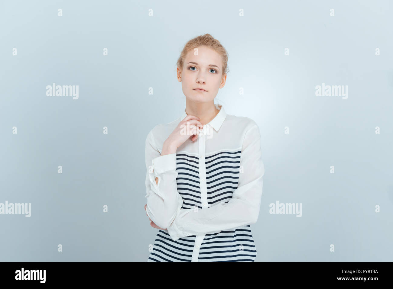 Teen girl looking at camera thinking hi-res stock photography and ...