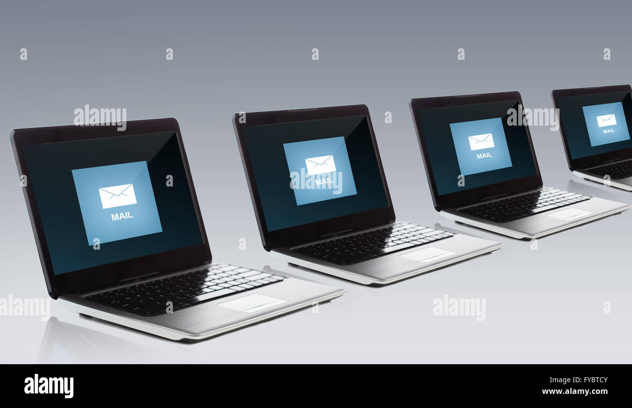 laptop computers with email message icon on screen Stock Photo - Alamy
