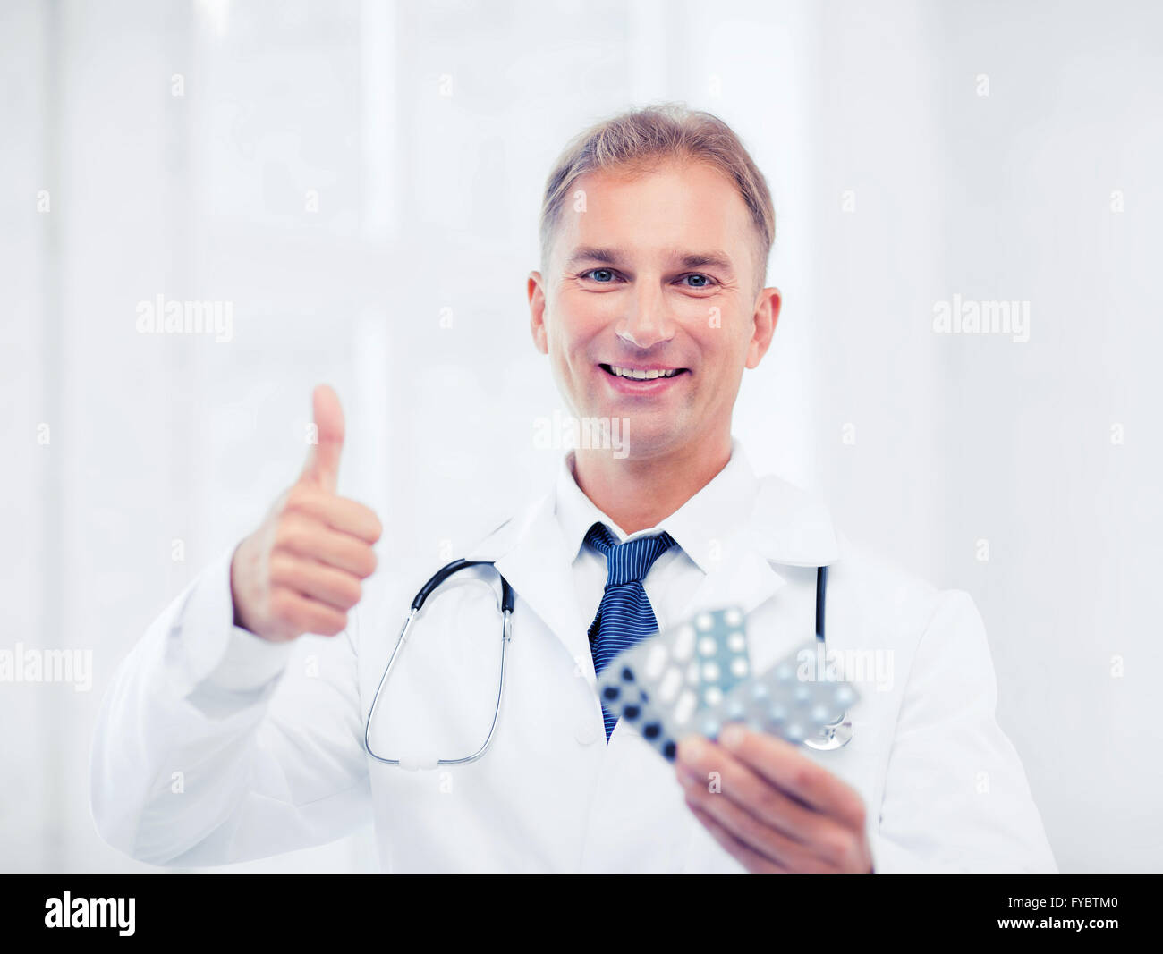 male doctor with packs of pills Stock Photo - Alamy