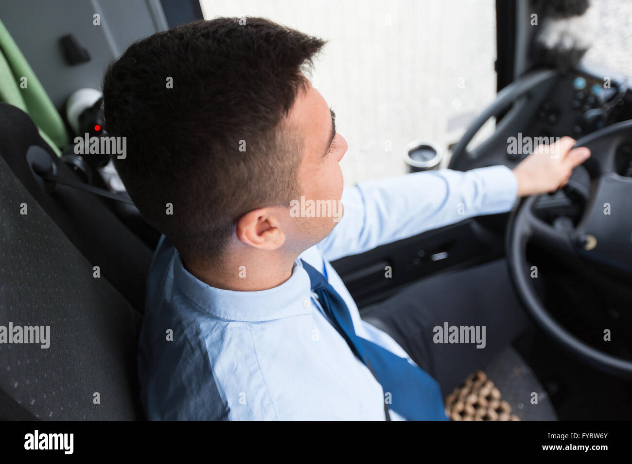 close up of driver driving passenger bus Stock Photo - Alamy