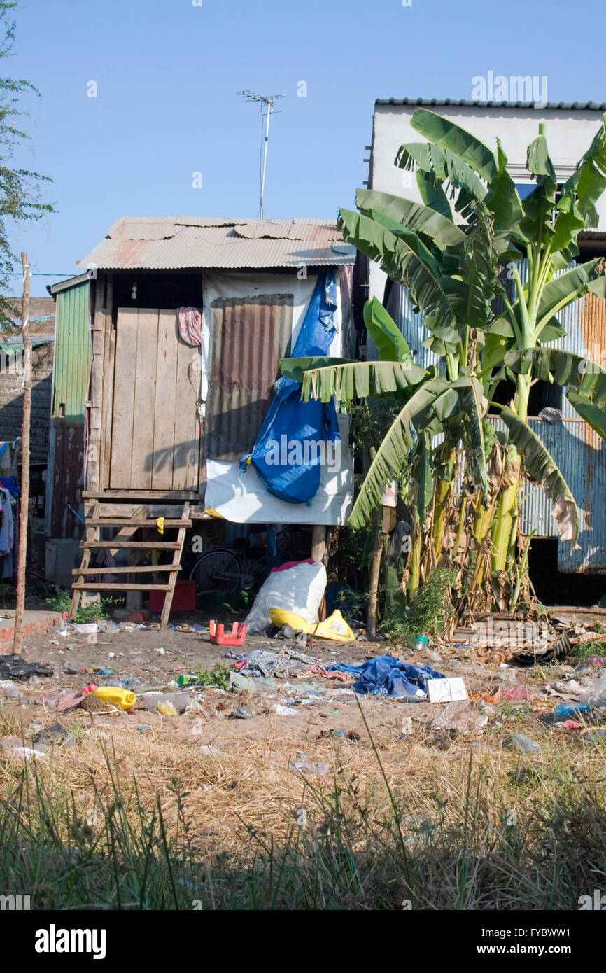 A ramshackle wood home is part of the urban landscape in Kampong Cham ...