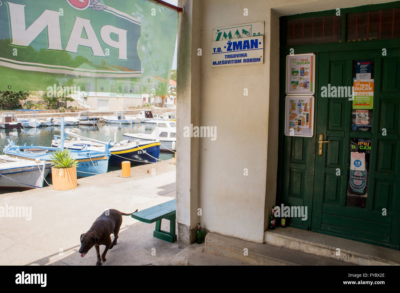 Zman port, Dugi Otok island, shop, PAN poster, advert, dog Stock Photo ...