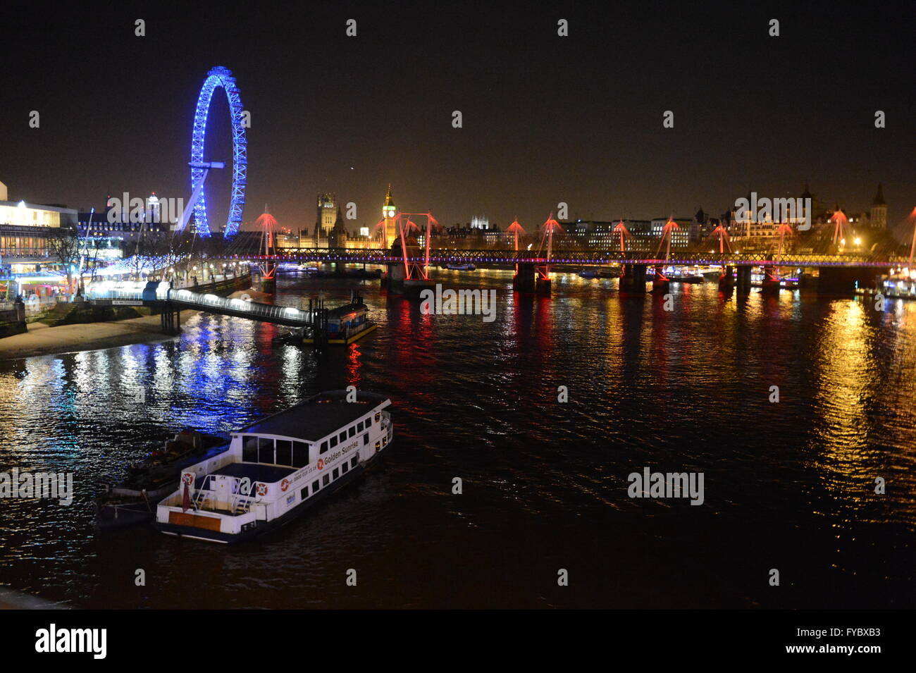 Christmas Lights London on the Thames London eye lit up boat water ...