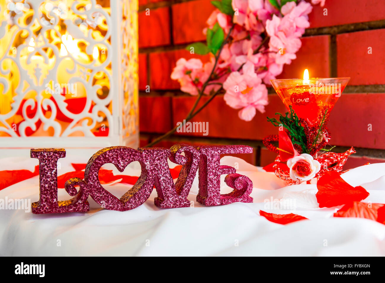 Composition with love plastic letters and candle burning Stock Photo ...