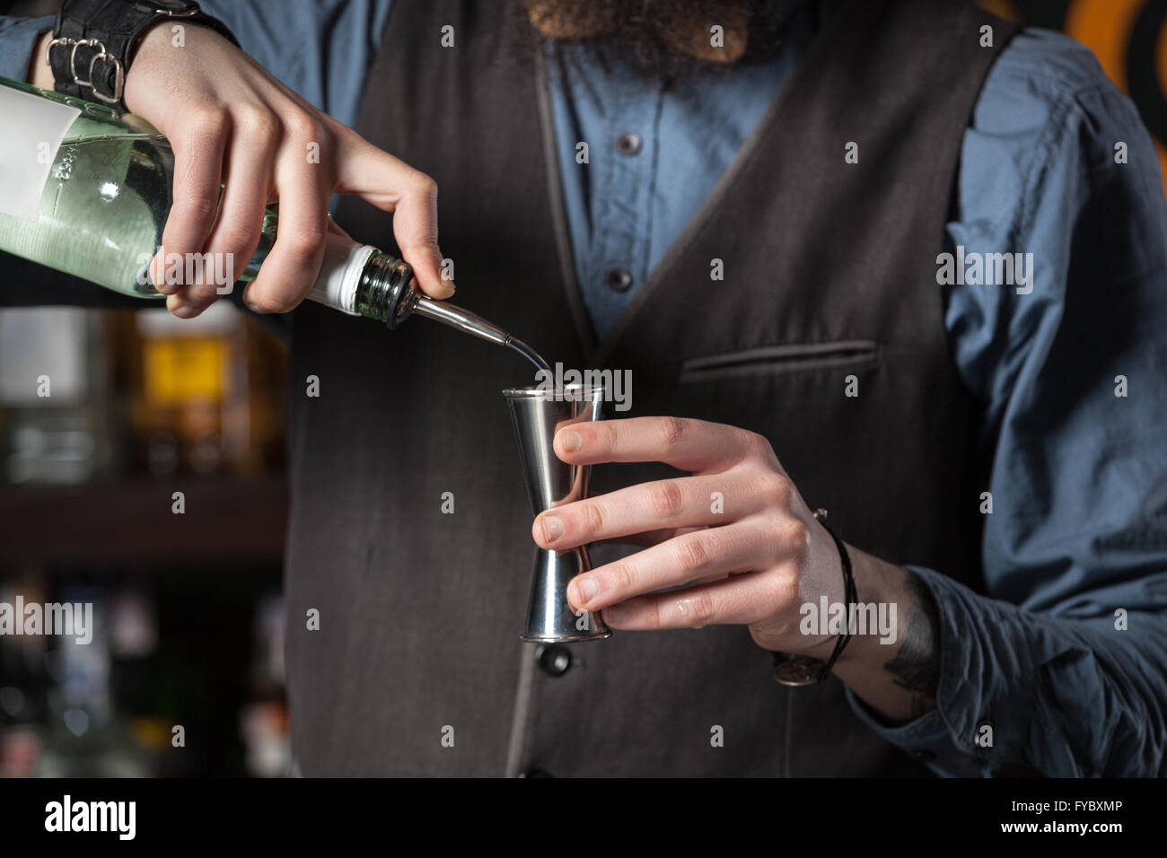 Bartender pouring alcohol jigger in hi-res stock photography and images - Alamy
