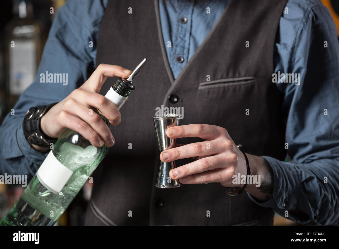 Bartender pouring alcohol jigger in hi-res stock photography and images - Alamy