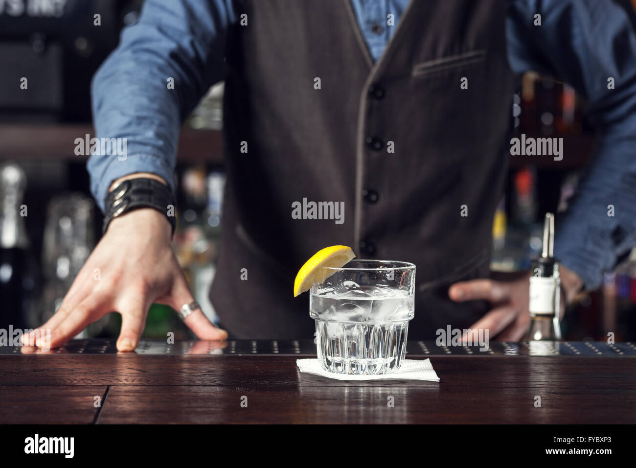 Barman serving cocktail Stock Photo - Alamy