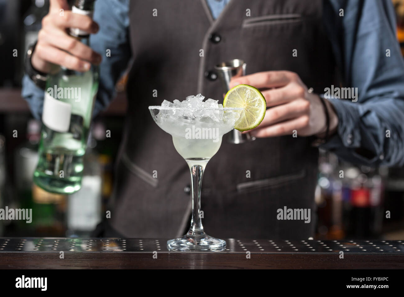 This is a photograph of barman serving cocktail Stock Photo - Alamy