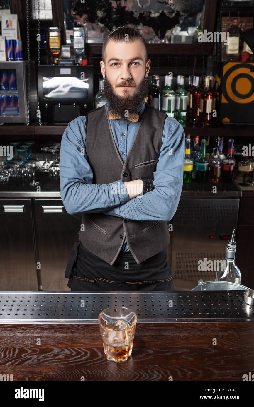 Confident Barman serving cocktail at the bar Stock Photo - Alamy