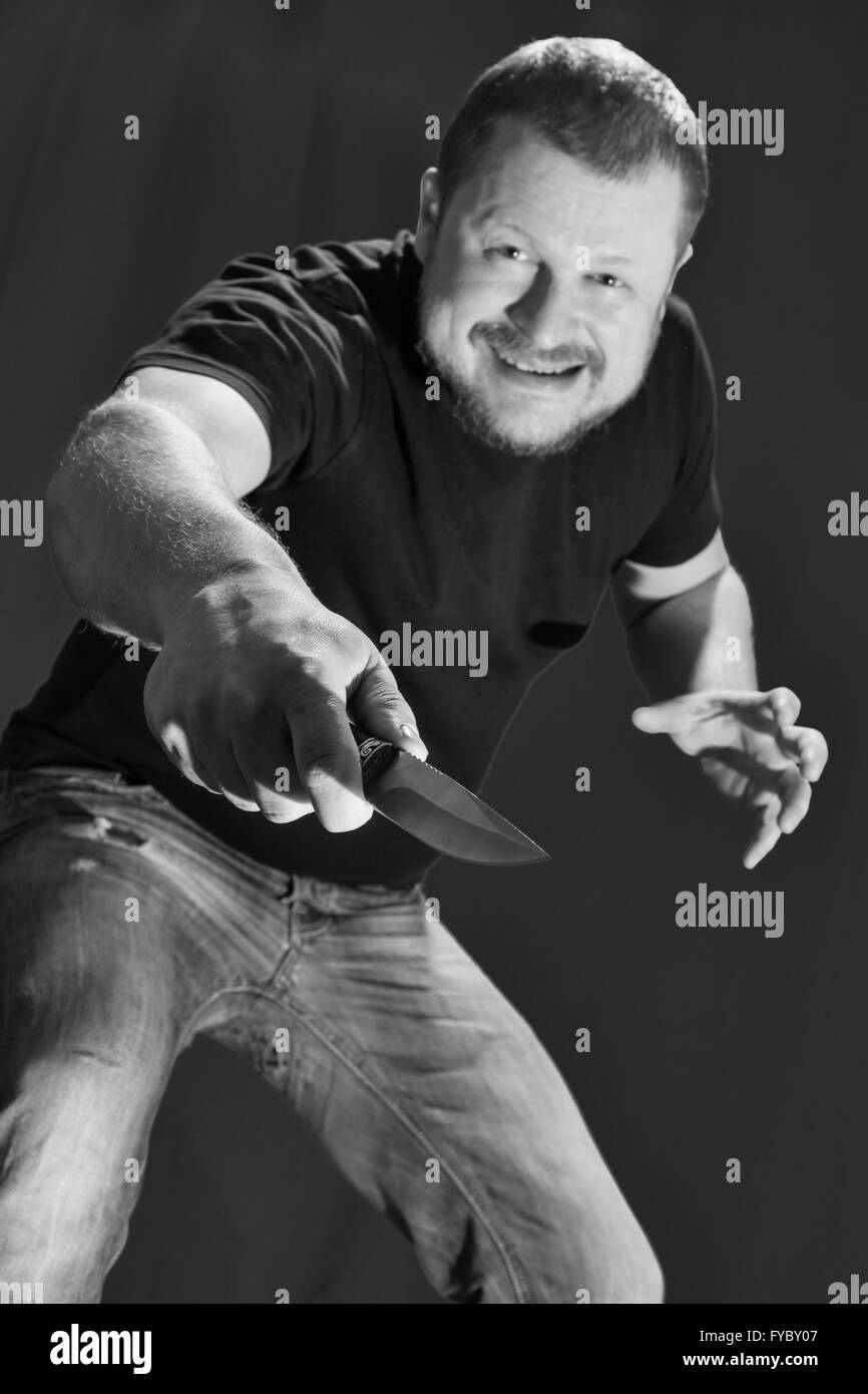 Emotional portrait of agressive bully fighting on black background ...