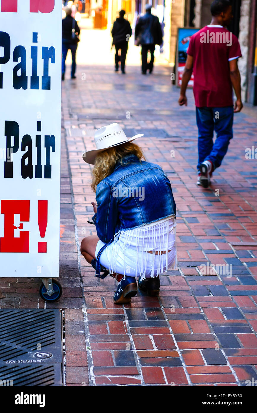 Girl in cowboy boots hi-res stock photography and images - Alamy