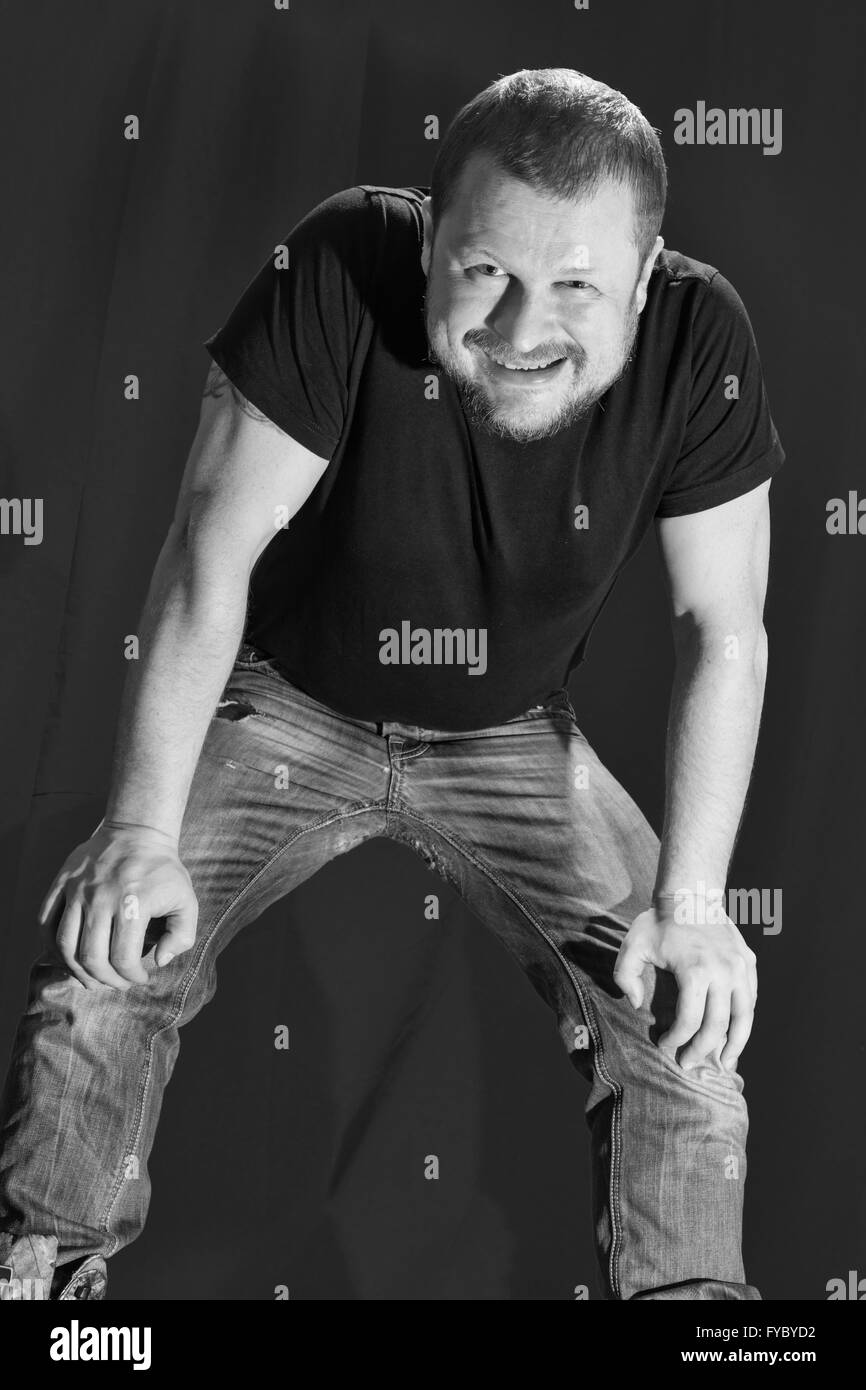 Portrait of a bully ready to fight on black background Stock Photo - Alamy