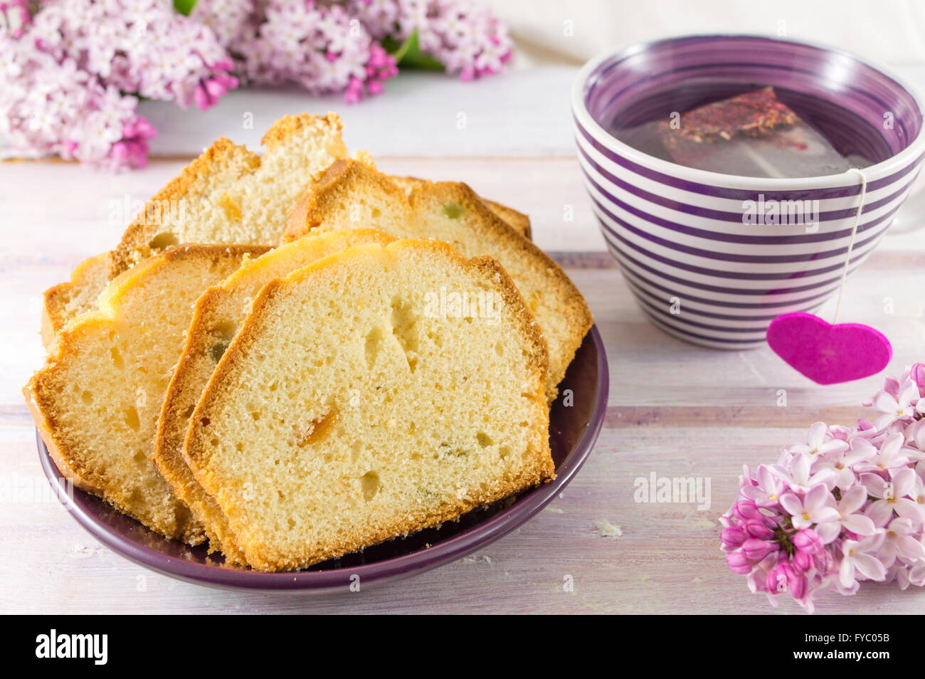 Homemade fruit bread slices with spring flowers and tea Stock Photo - Alamy