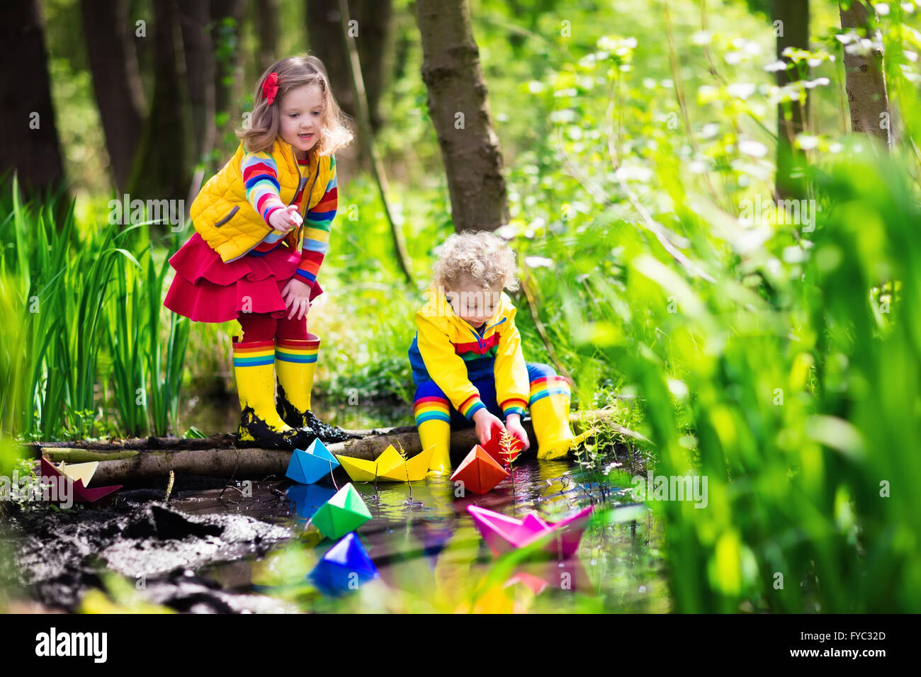 Kids playing paper boats hi-res stock photography and images - Alamy