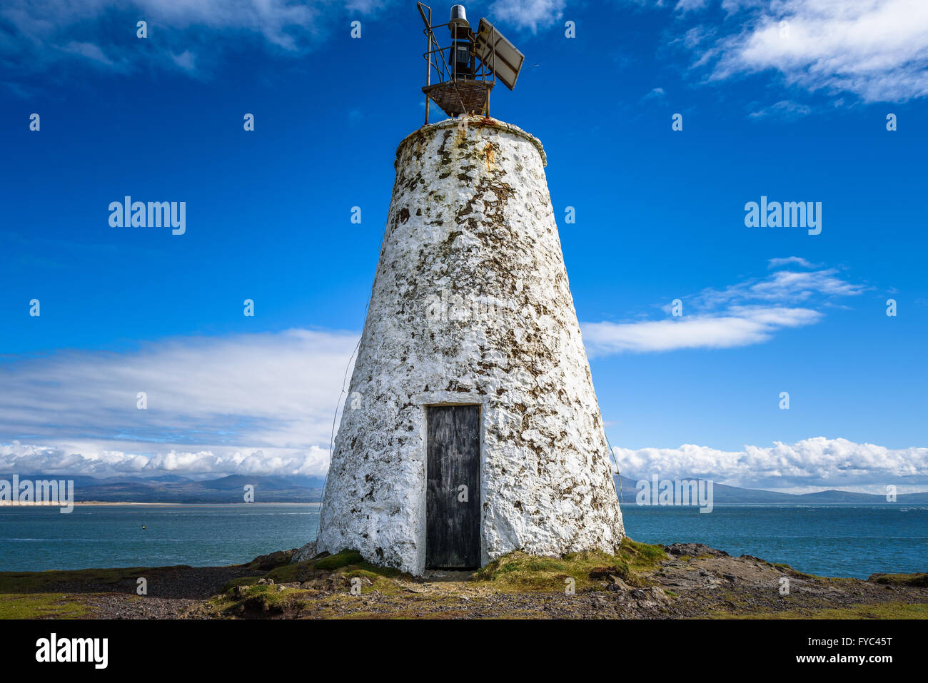 The small Twr Bach lighthouse on the island of Llanddwyn, Anglesey ...