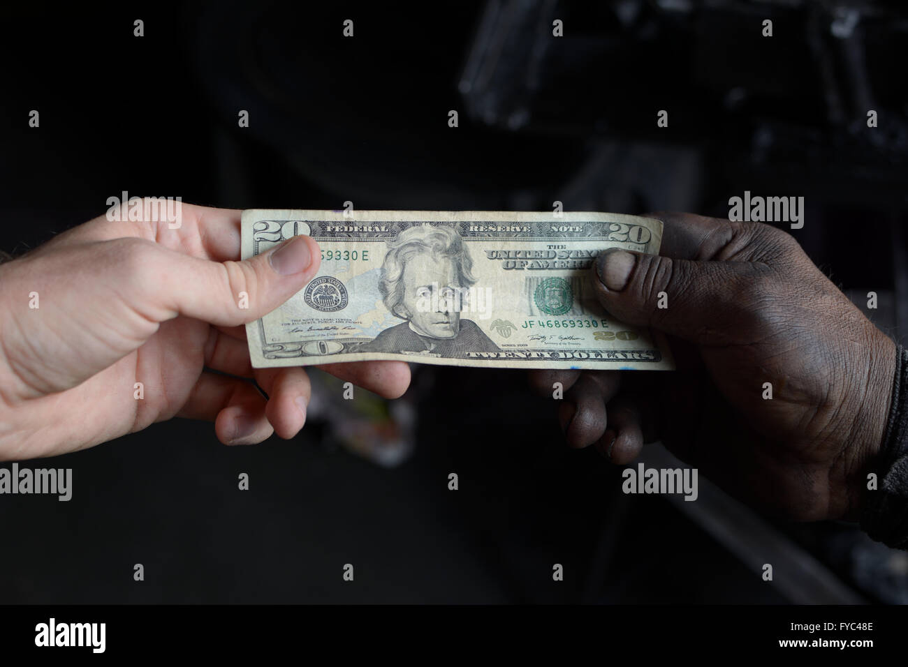 One custome hand giving money to another worker hand Stock Photo - Alamy