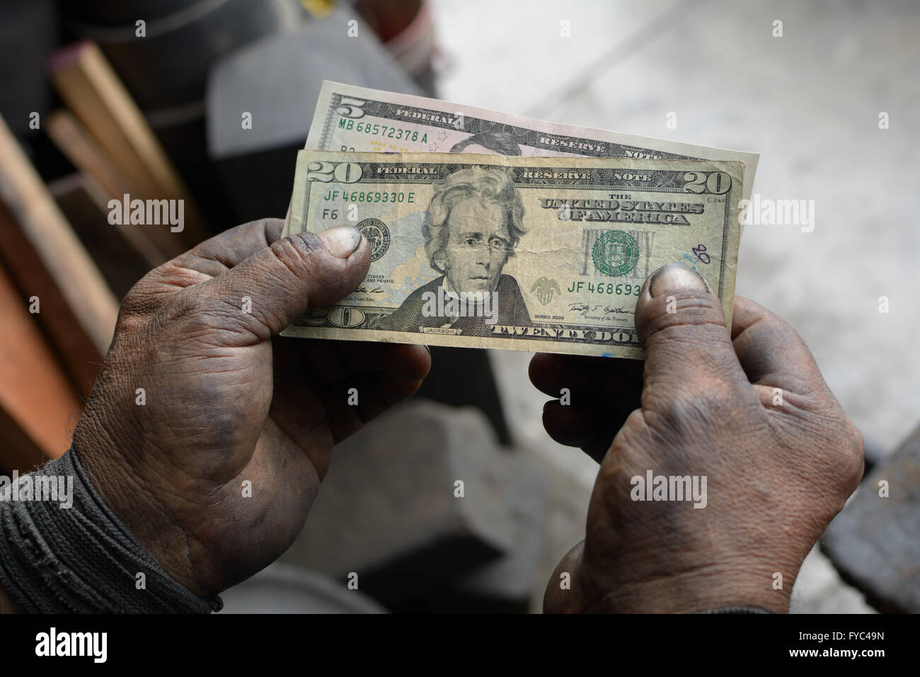 Dirty worker hands with cash money Stock Photo - Alamy