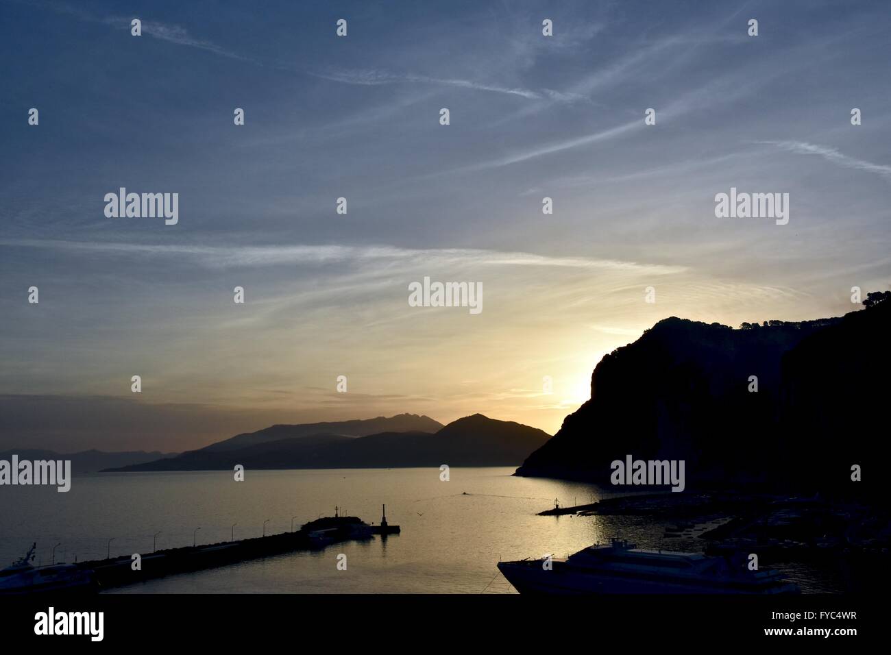 Sunset over the harbor on Capri island, Italy Stock Photo - Alamy