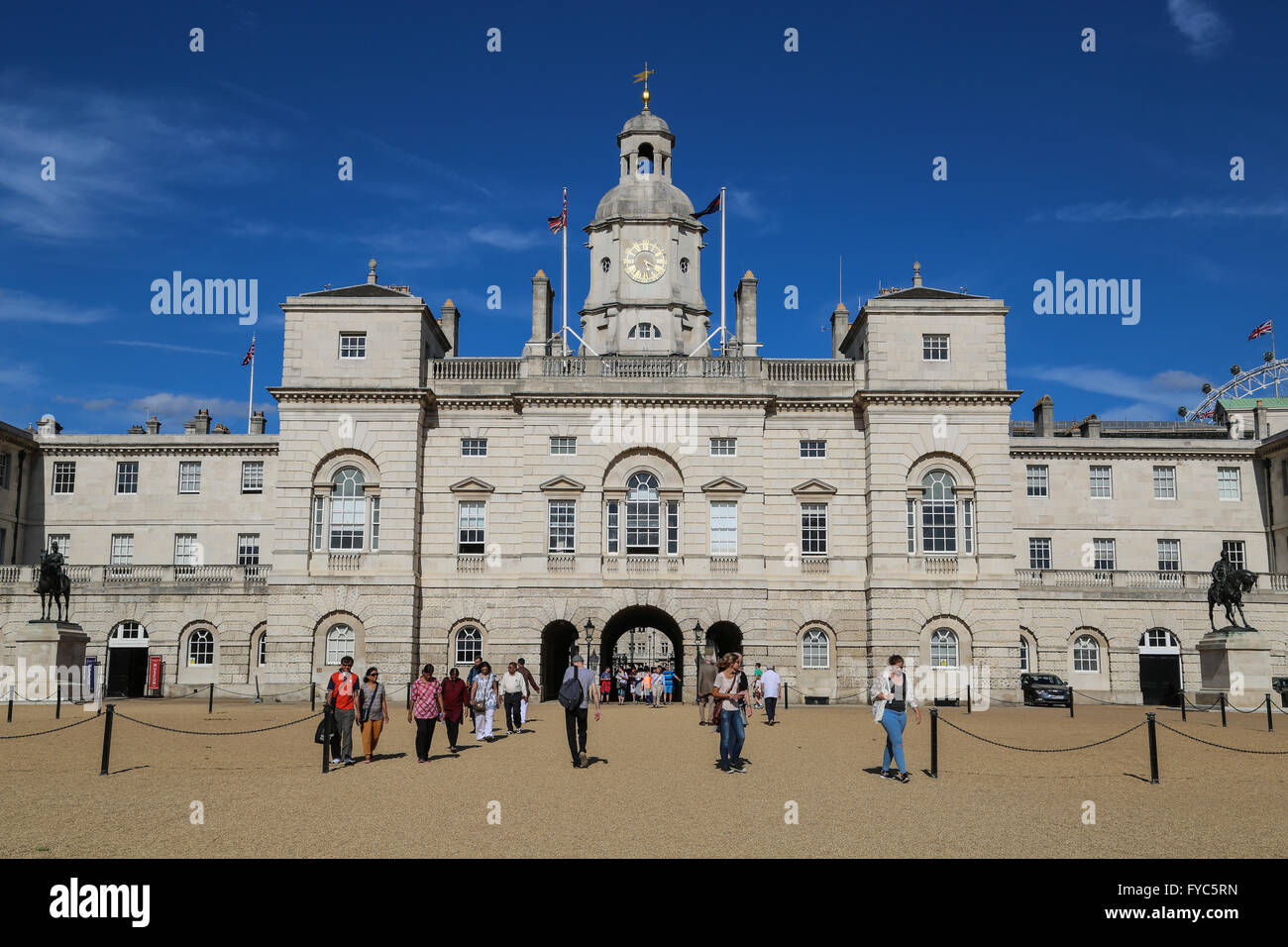 Tourists enter the historic Horse Guards Parade building in London ...