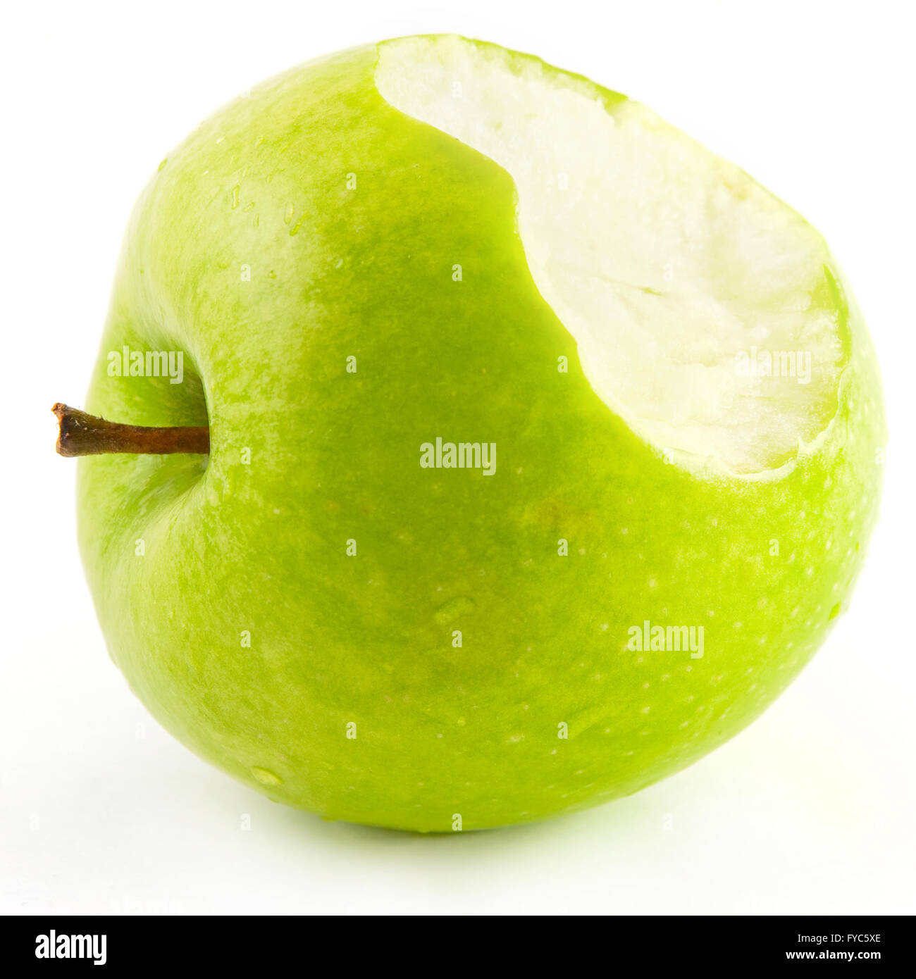 bitten off green apple Stock Photo - Alamy