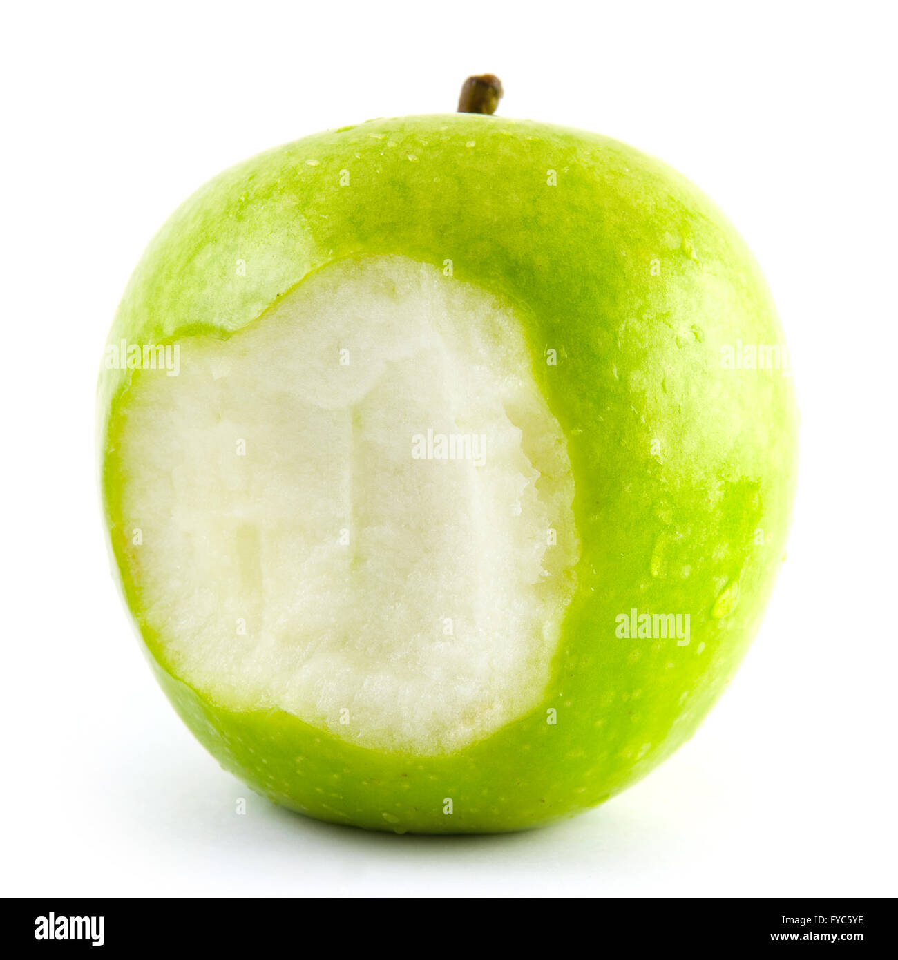 bitten off green apple Stock Photo - Alamy