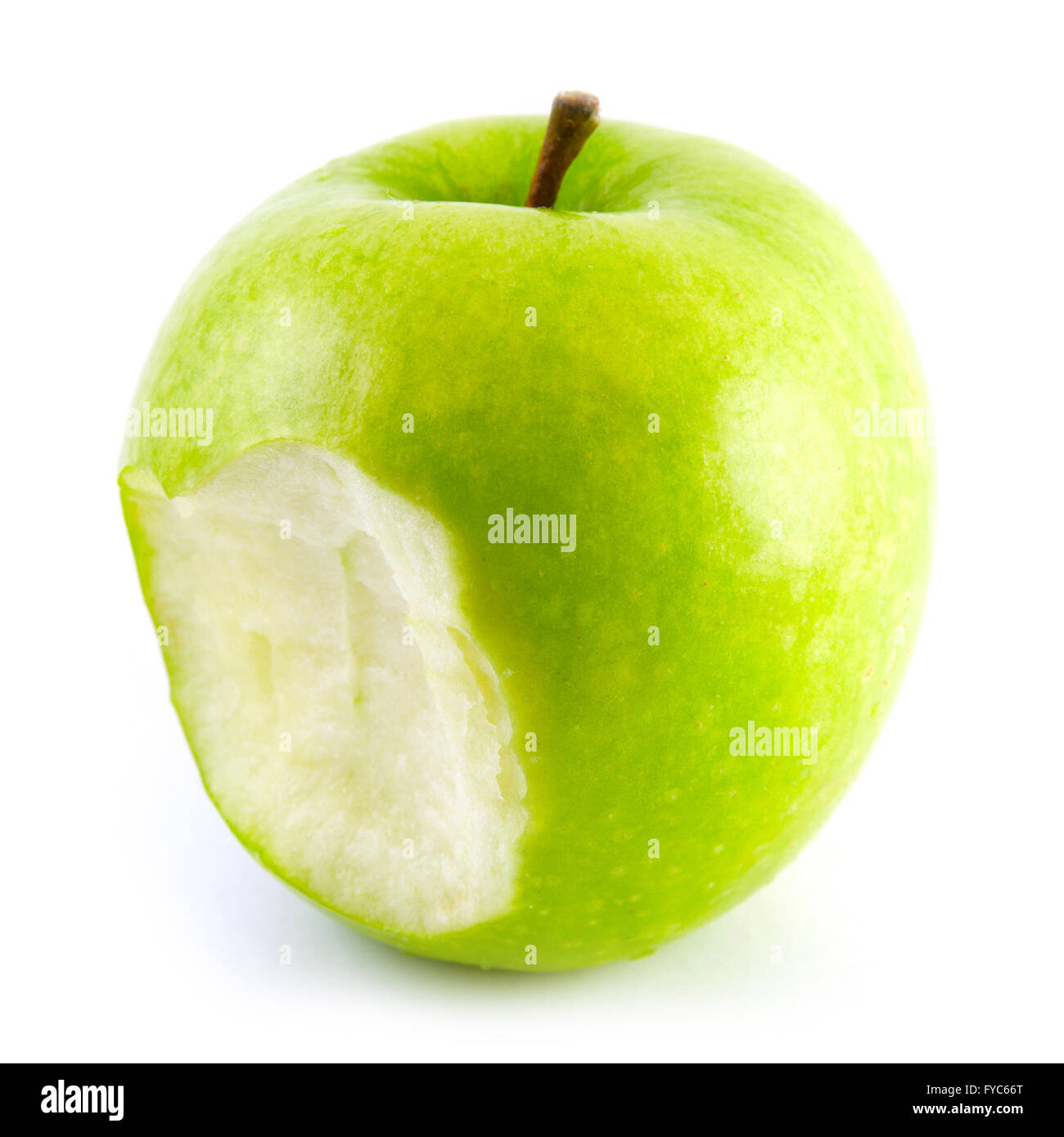 The bitten off green apple Stock Photo - Alamy