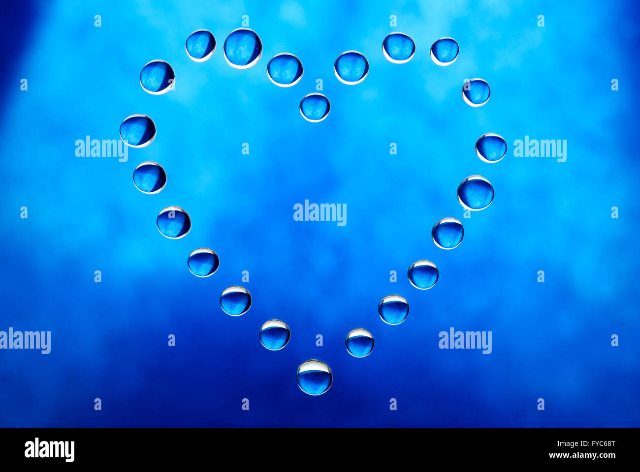 Blue heart shape made of water droplets Stock Photo - Alamy
