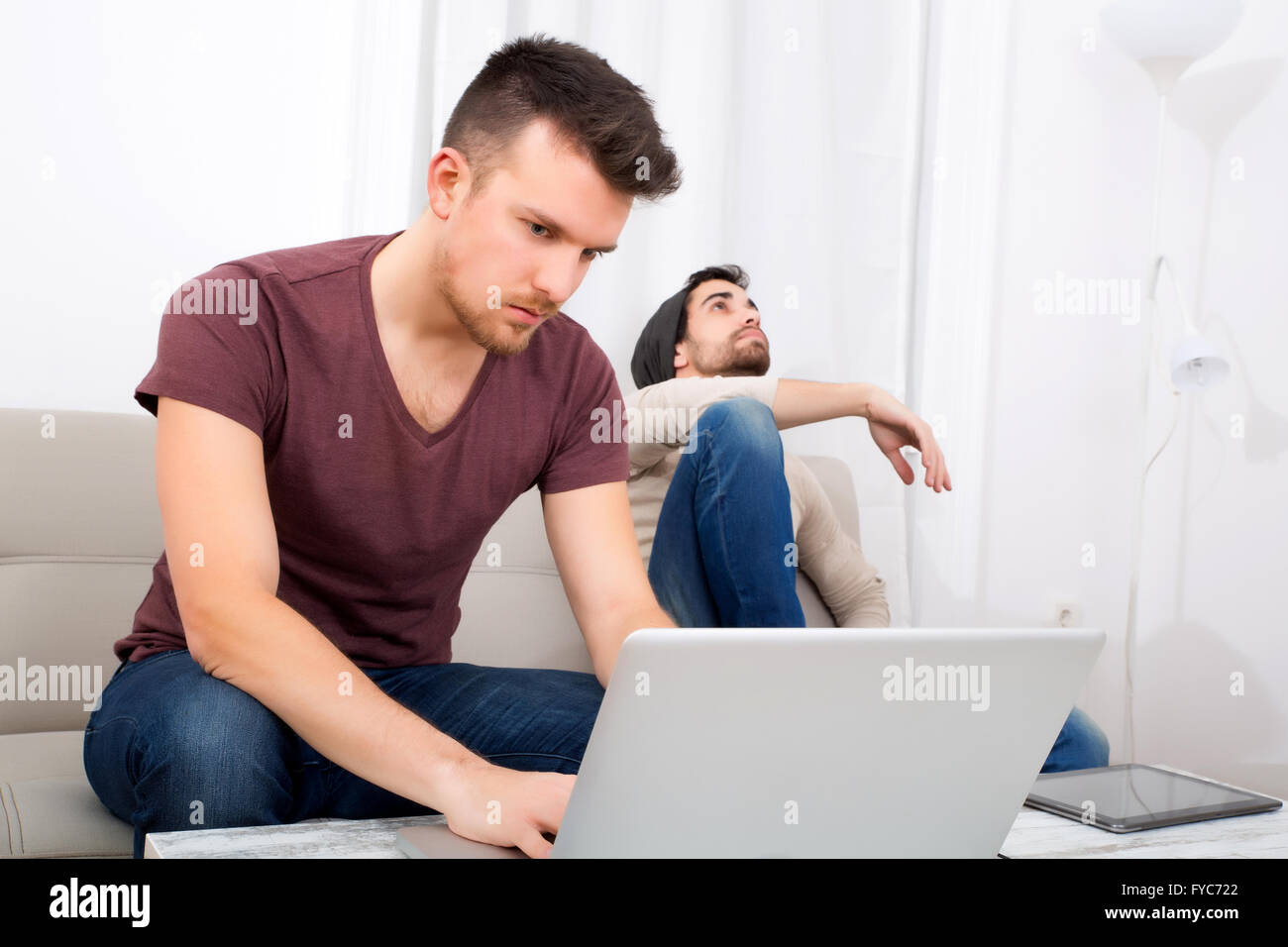 Two young men studying at home Stock Photo - Alamy