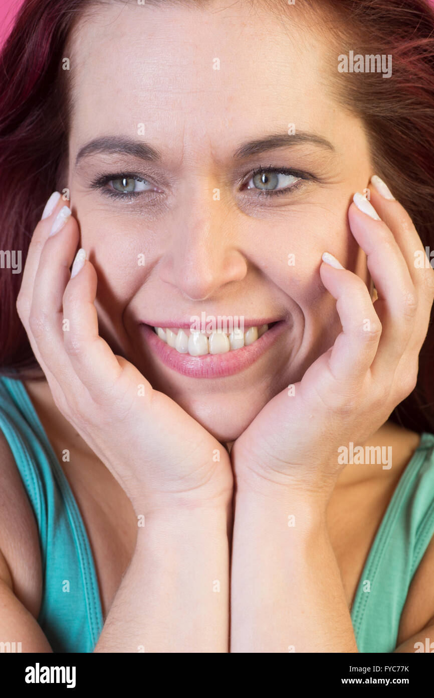 Happy woman hands on face Stock Photo - Alamy