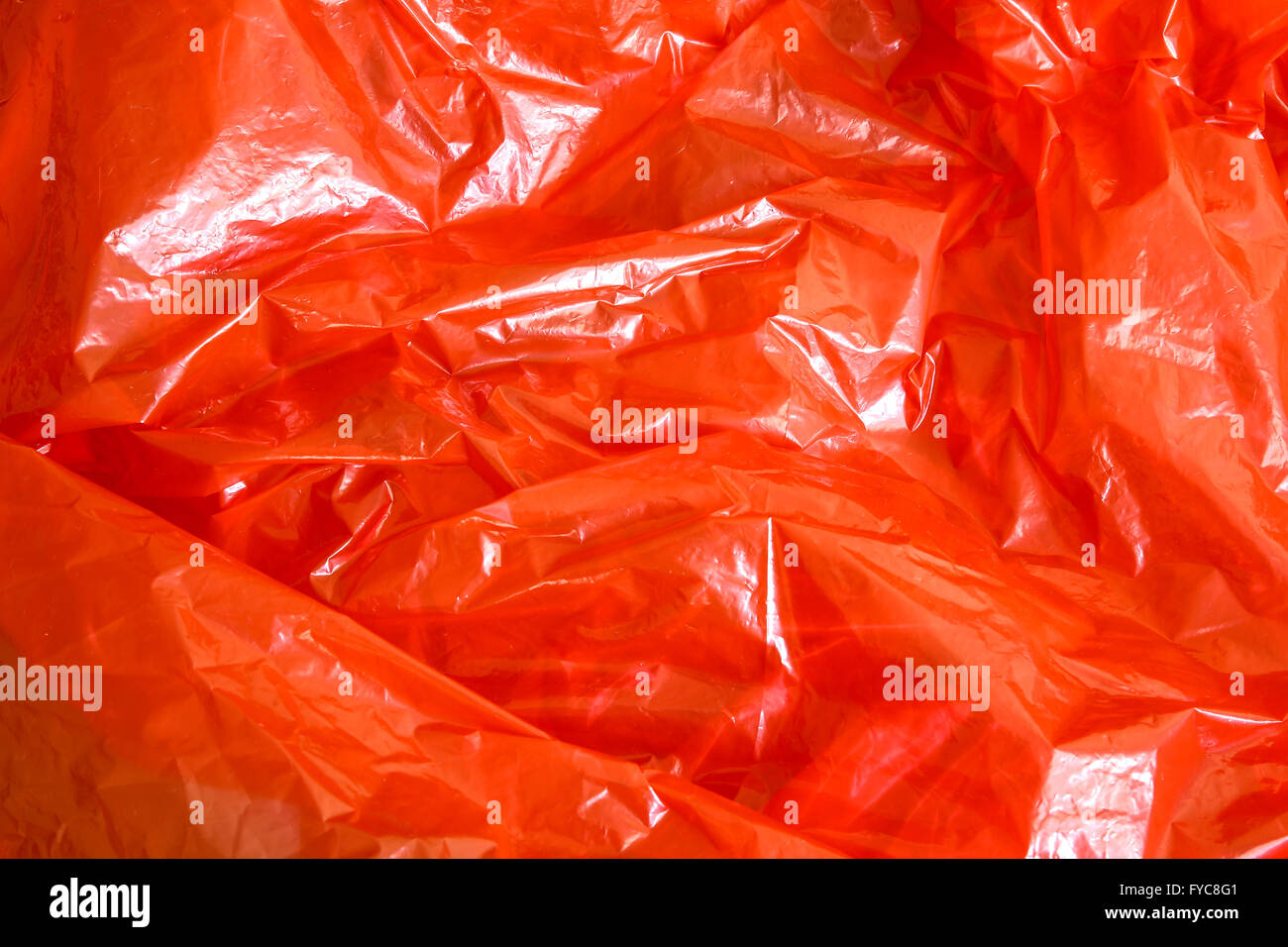A background of red plastic foil Stock Photo - Alamy