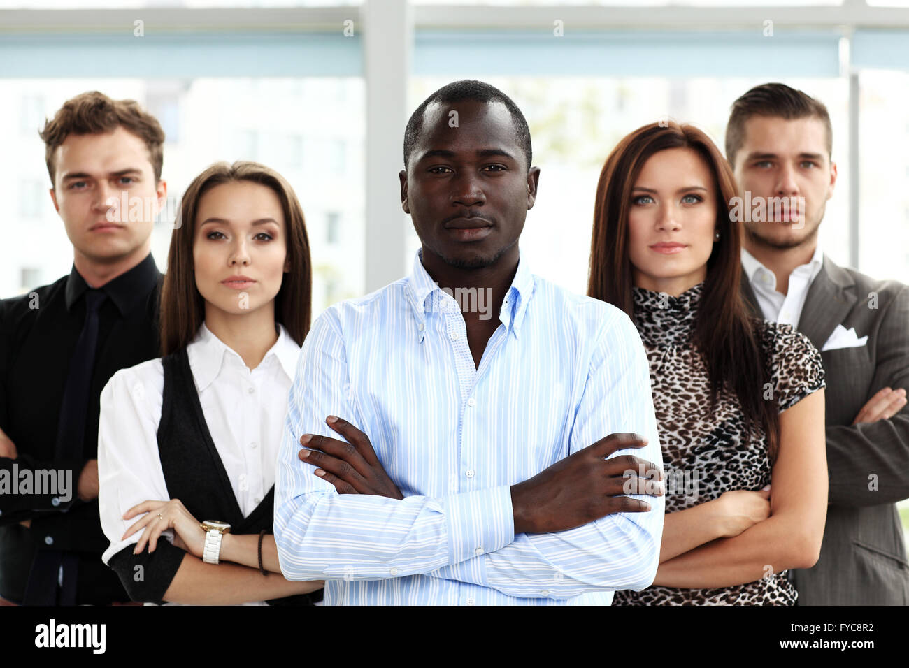 Successful business team smiling at office Stock Photo - Alamy