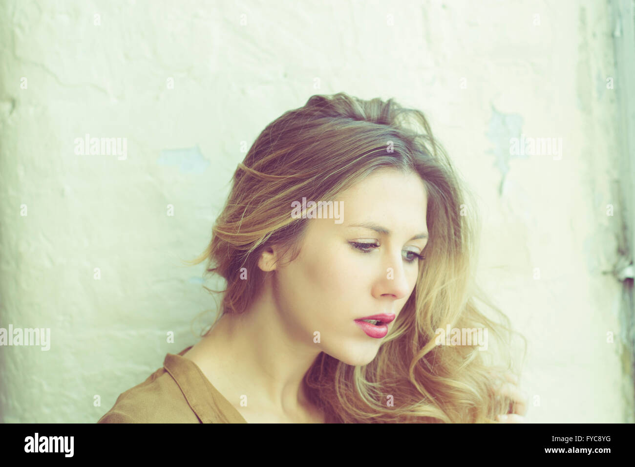 Worried young woman looking away Stock Photo - Alamy