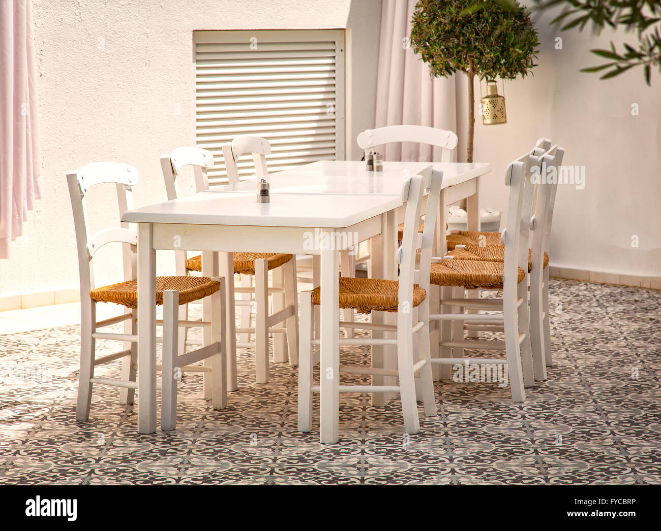 Image of classic greek table and chairs in a shaded courtyard Stock ...