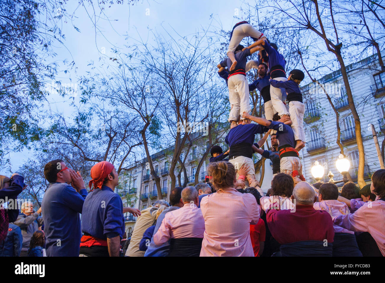 Support and encouragement during the creation of a human tower in ...