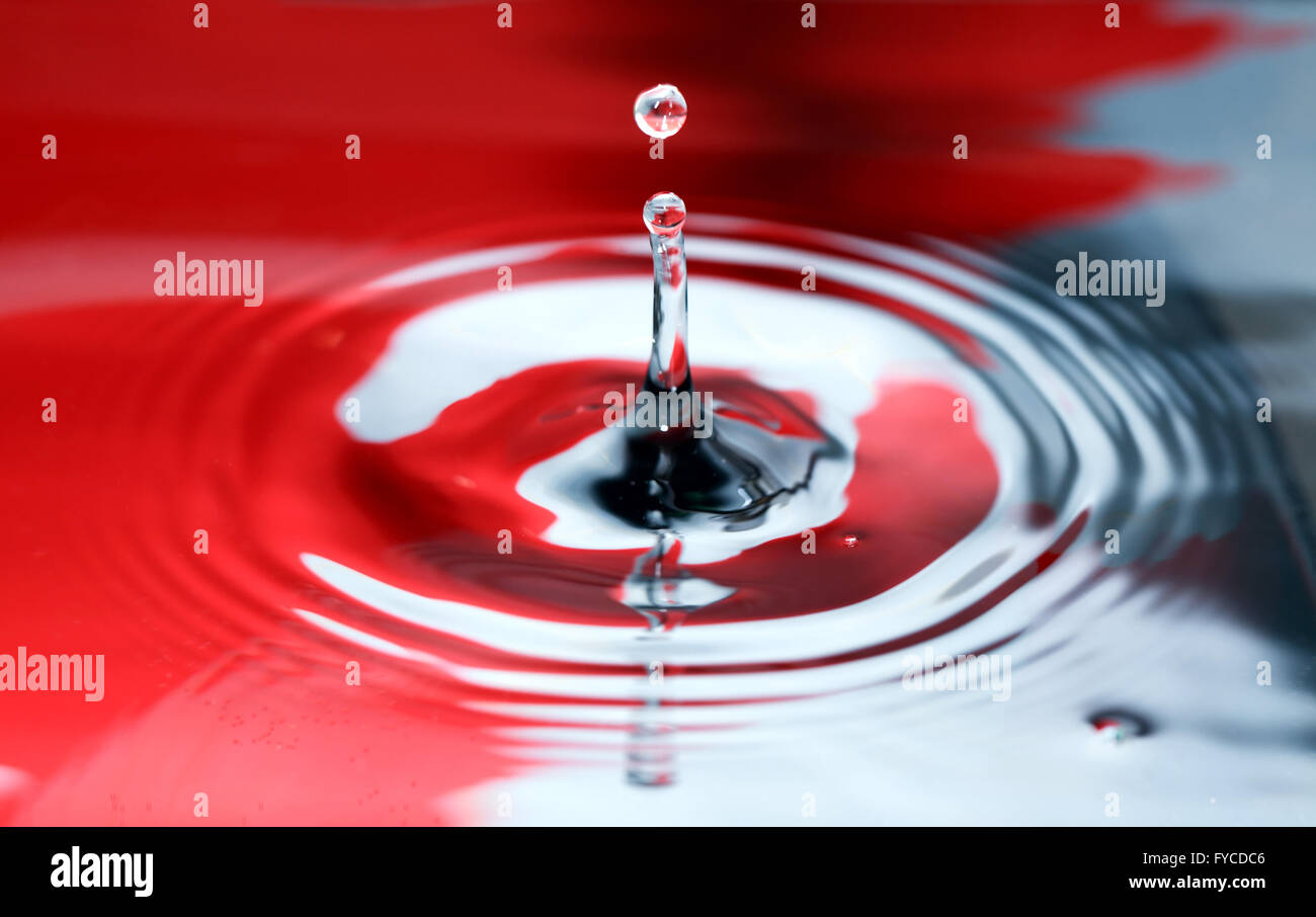 Abstract red and black water splash with drop closeup Stock Photo - Alamy