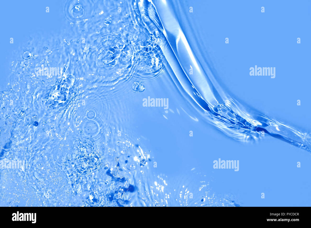 Nice blue background with long water splash Stock Photo - Alamy