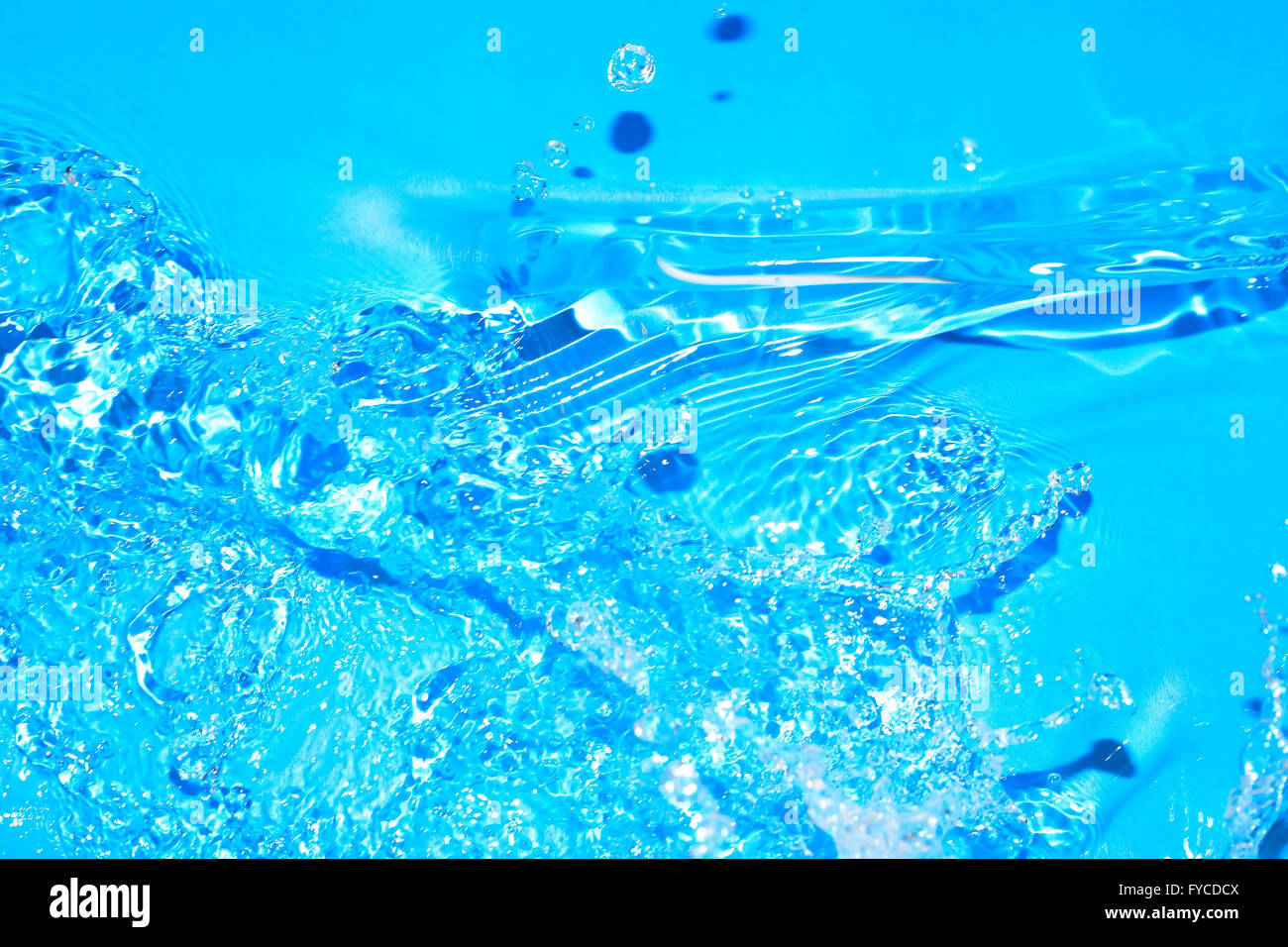 Nice blue background with long water splash Stock Photo - Alamy