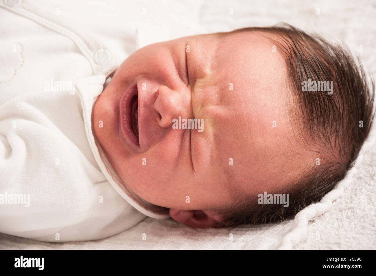 Newborn baby crying in close hi-res stock photography and images - Alamy