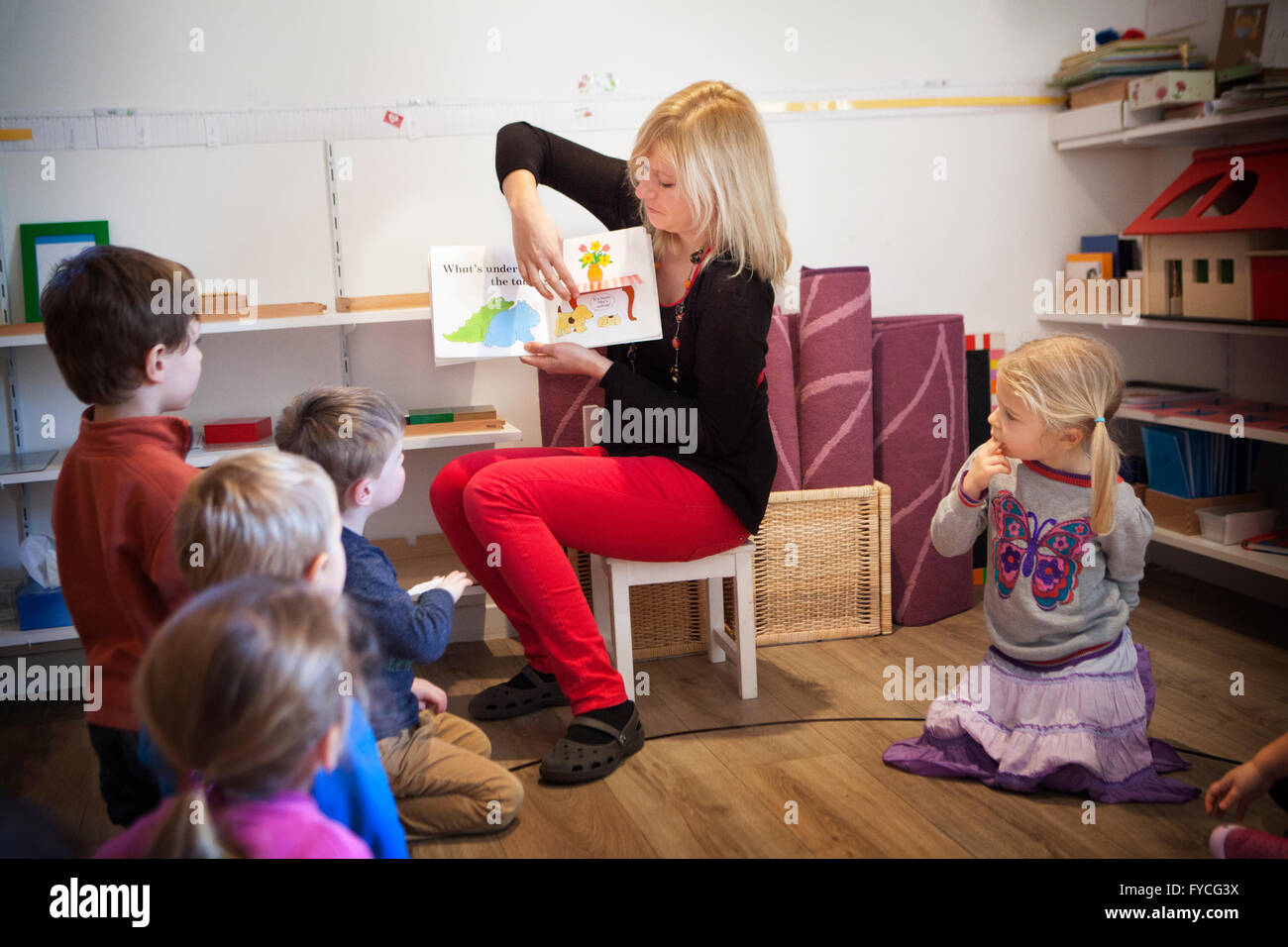 Nursery school reading teacher hi-res stock photography and images - Alamy