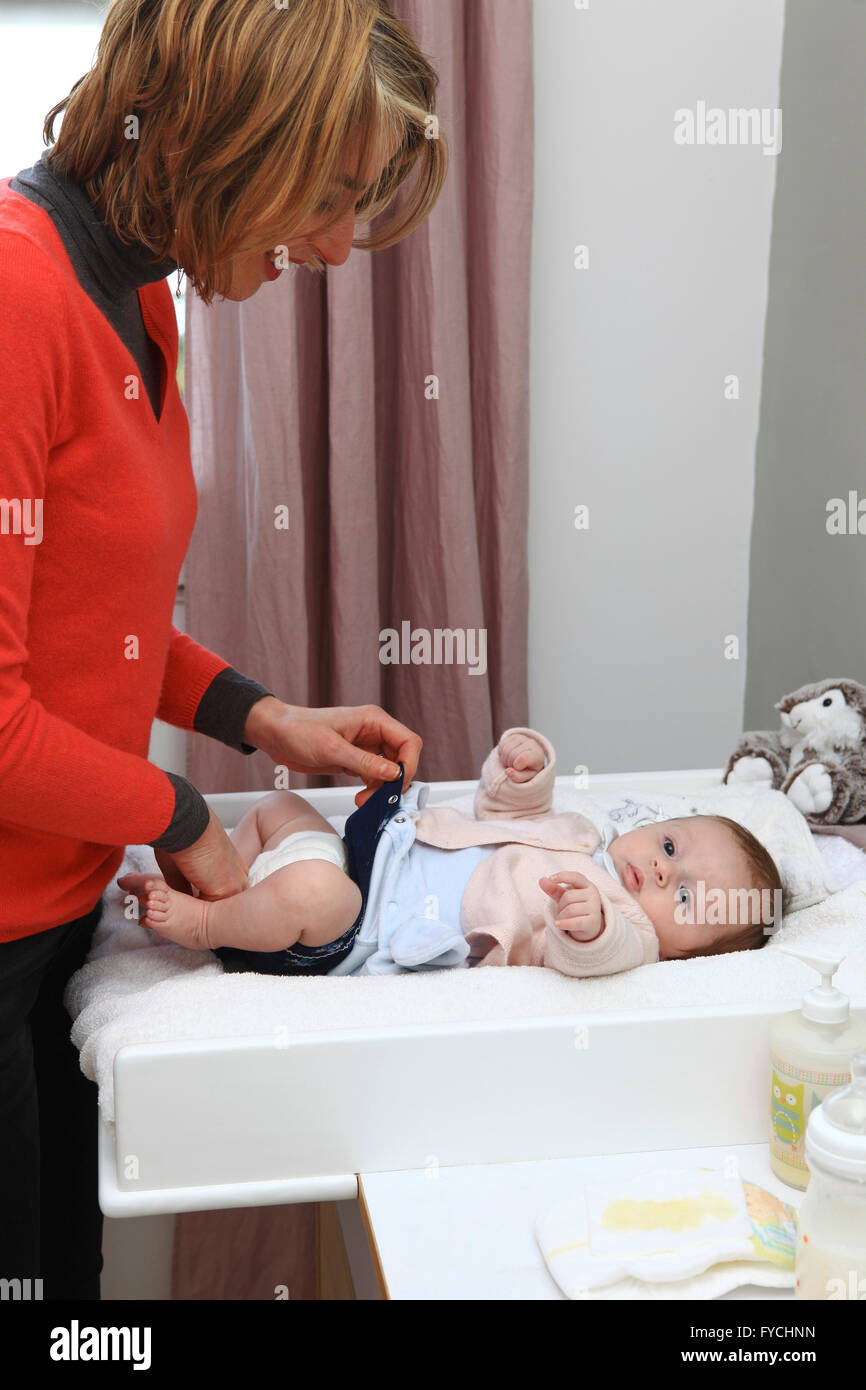 Caucasian changing baby girls diaper hi-res stock photography and ...