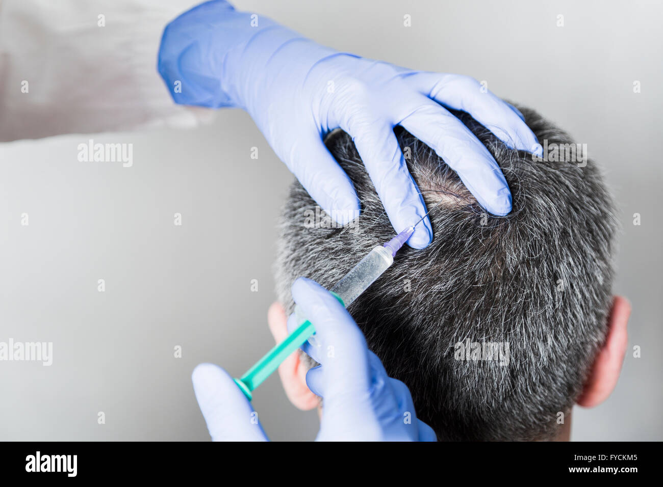 Doctor aesthetician makes head beauty injections to male patient Stock ...