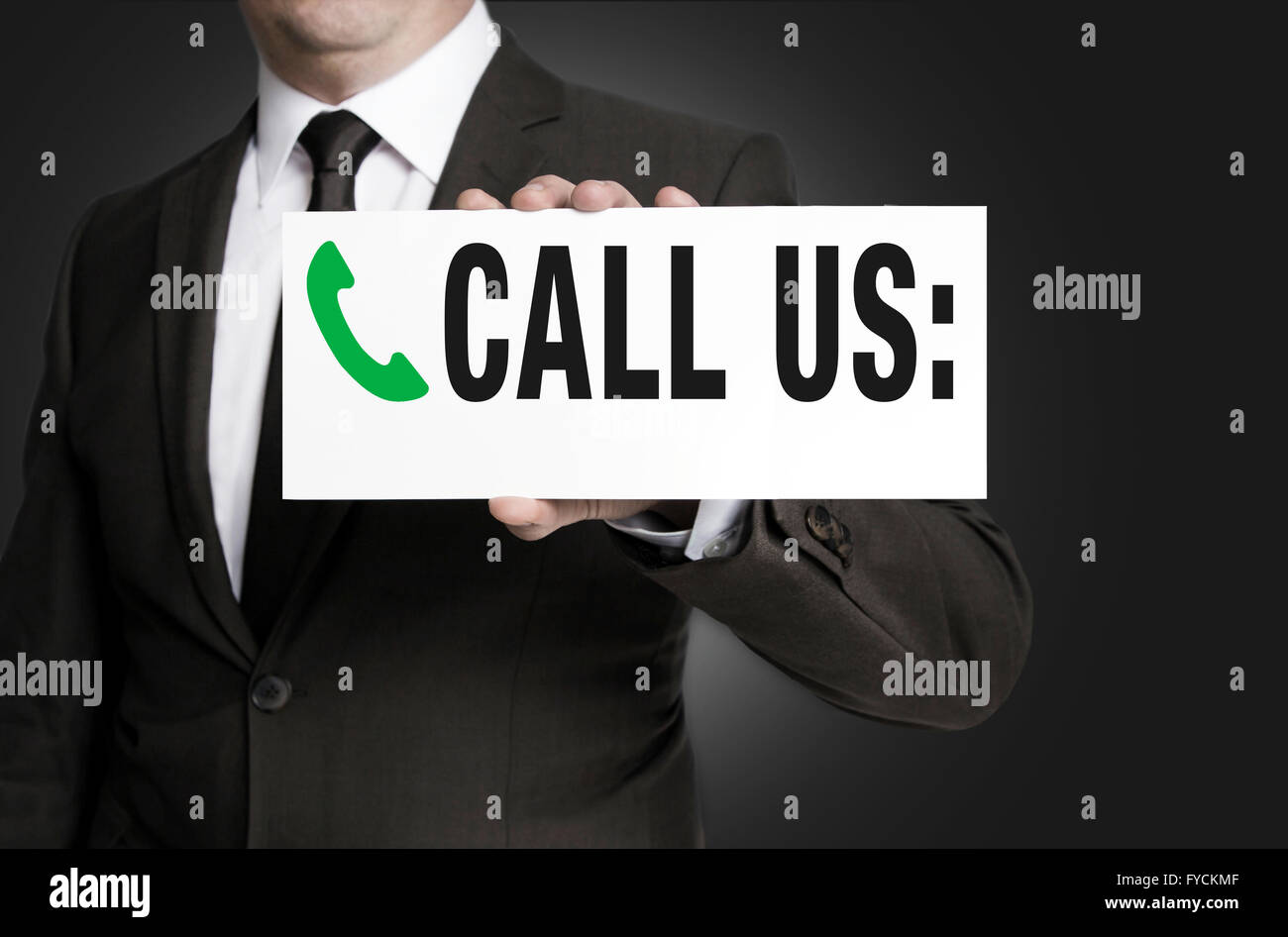call us sign is held by businessman background Stock Photo - Alamy