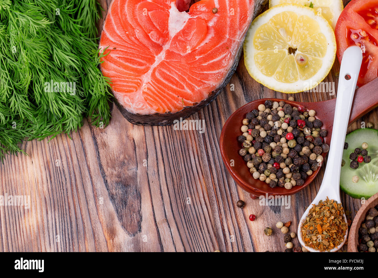 red fish steak with spices on wooden background Stock Photo - Alamy