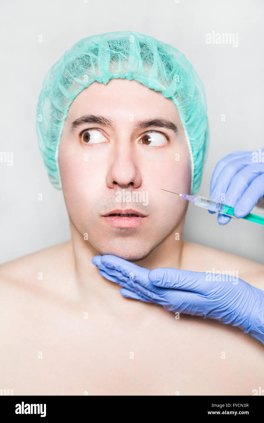 Doctor aesthetician makes face beauty injections to male patient Stock ...