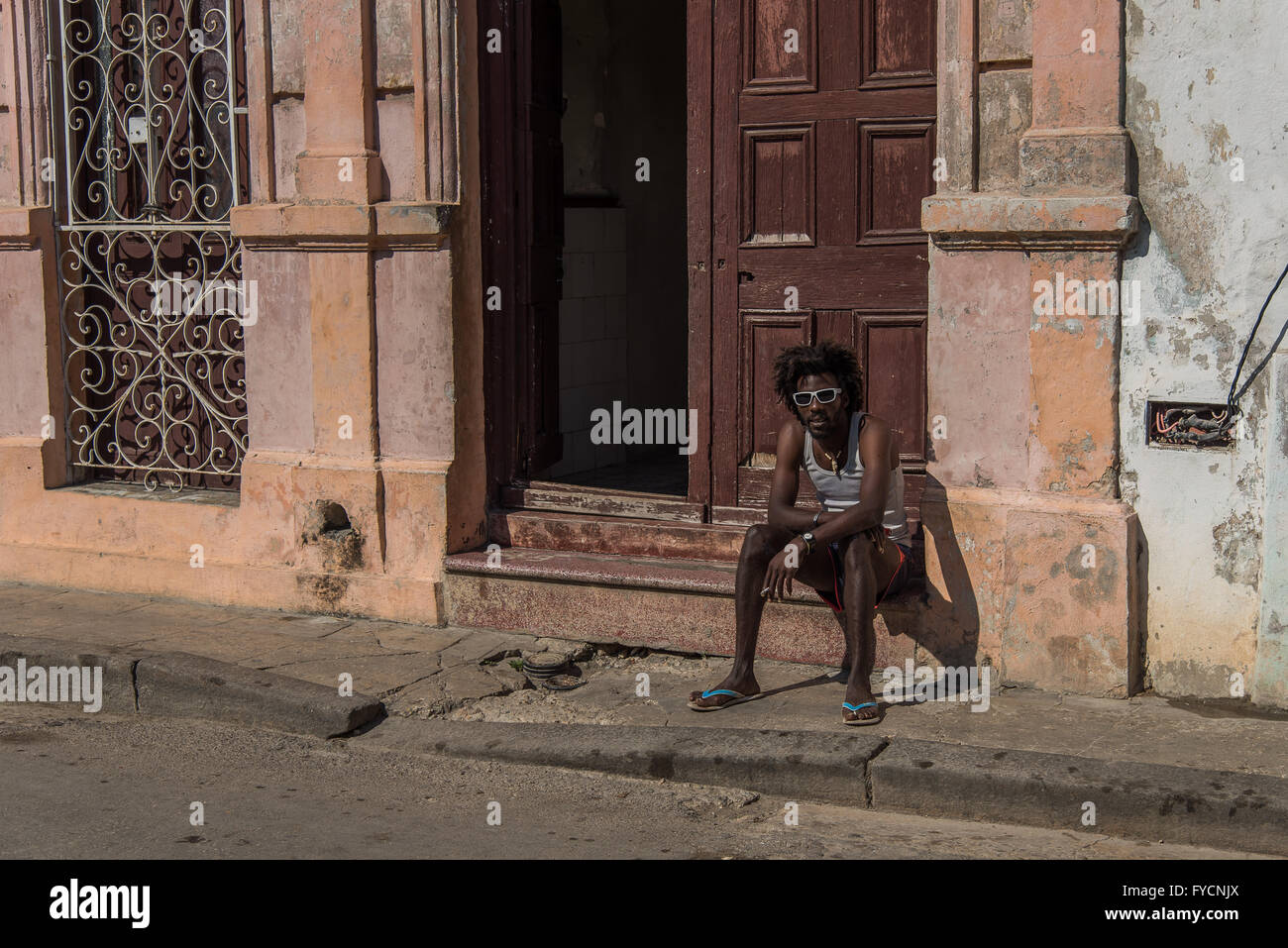 Local Cuban people going about their daily lives in the streets of Old ...