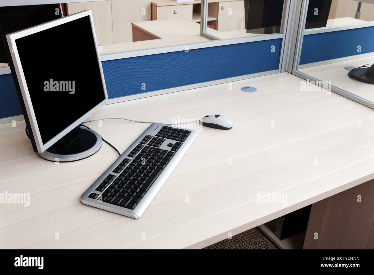 computers behind the glass in a modern office Stock Photo - Alamy