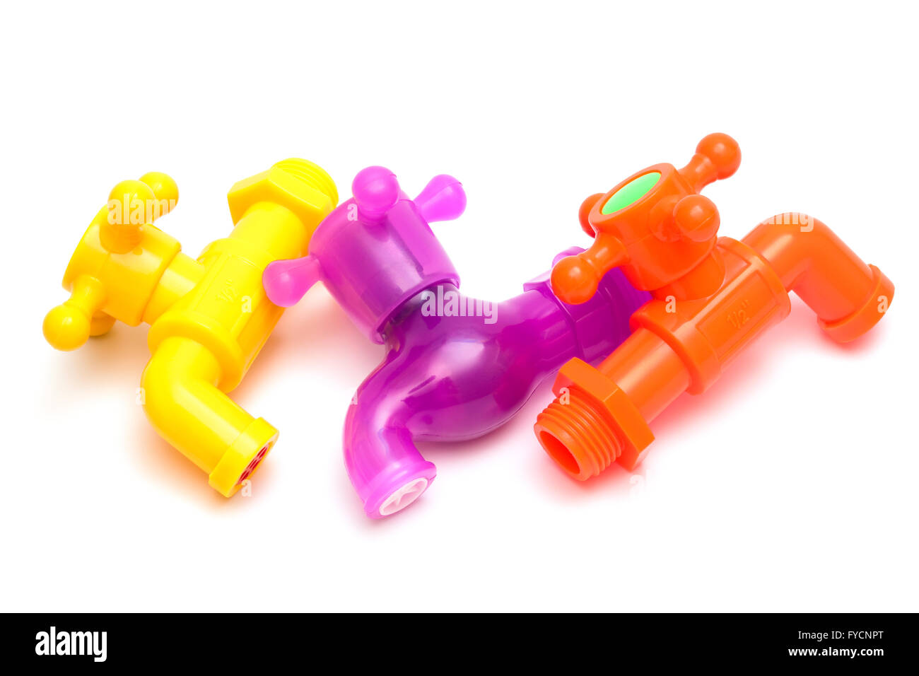 color plastic faucet on a white background Stock Photo - Alamy