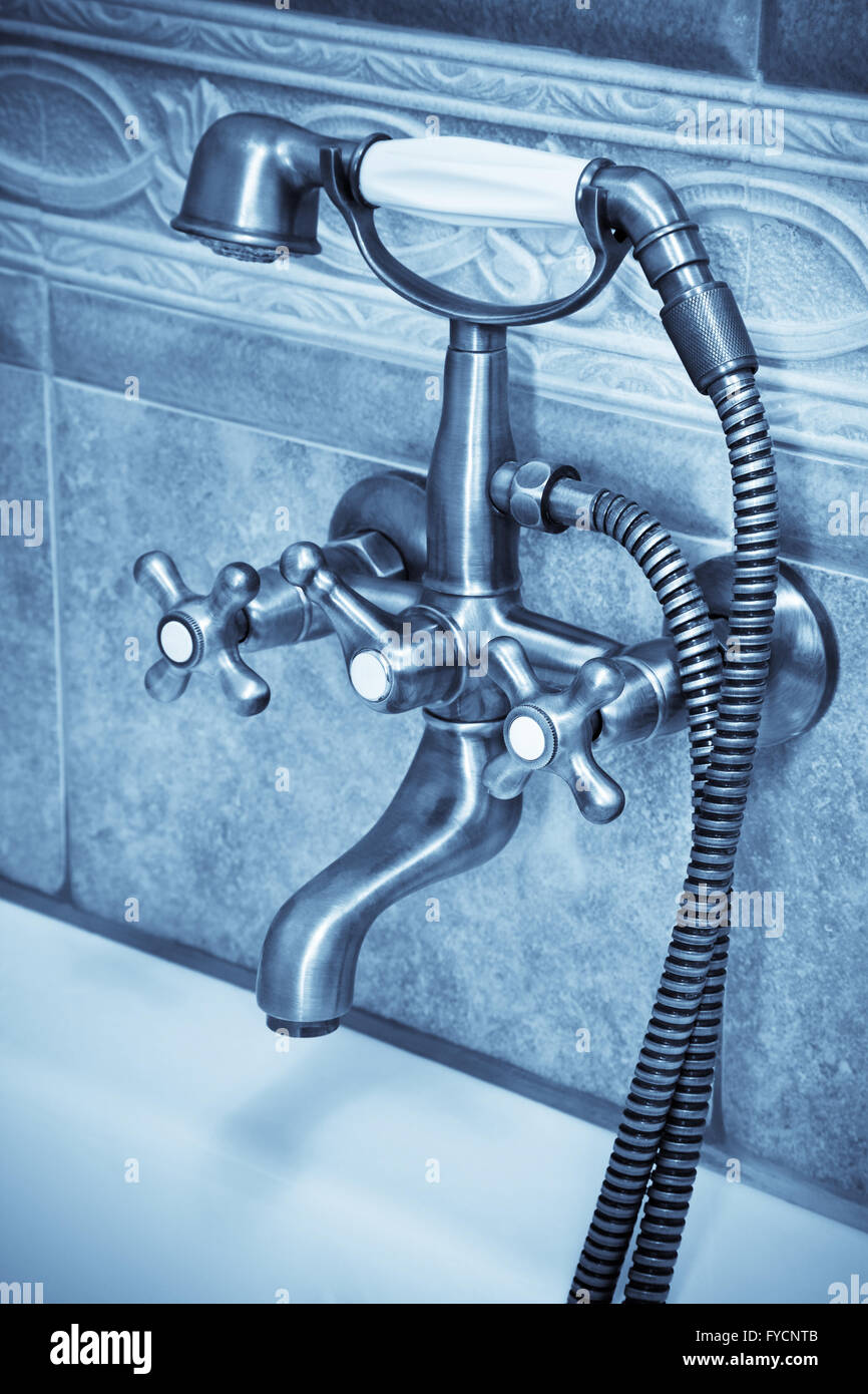 The beautiful old faucet in a bathroom Stock Photo - Alamy