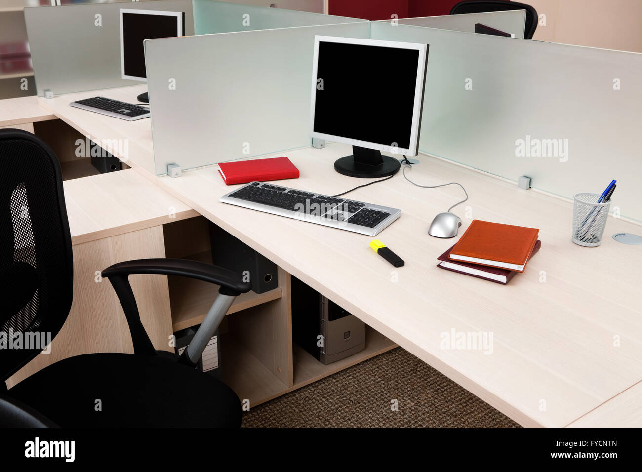 computers behind the glass in a modern office Stock Photo - Alamy