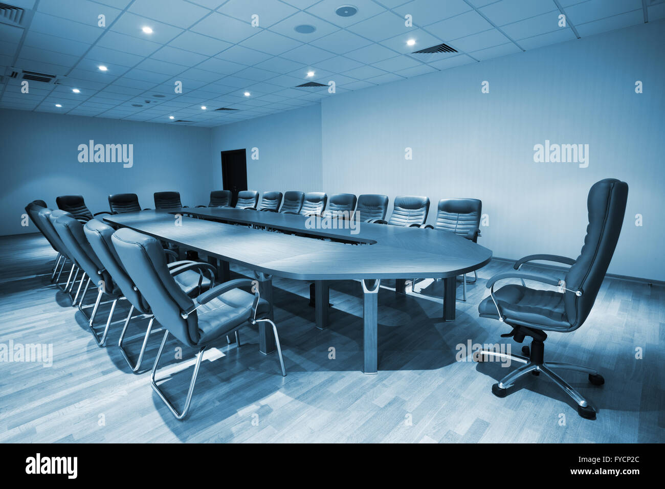 large table and chairs in a modern conference room Stock Photo - Alamy